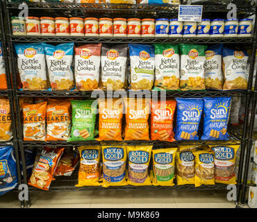 A display of tasty Frito-Lay brand chips, including Cheetos, in a ...