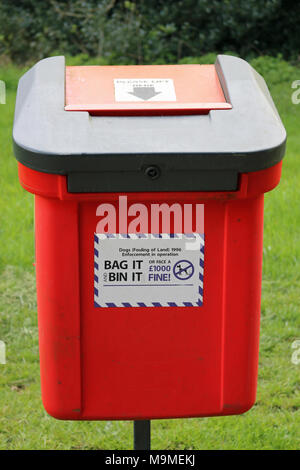 Red metal bin with lid on Stock Photo - Alamy