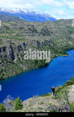 Tourist binoculars on the lake Lago di Garda, evening scene with water ...