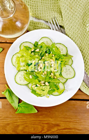 Salad from spinach and cucumbers with napkin on table Stock Photo - Alamy