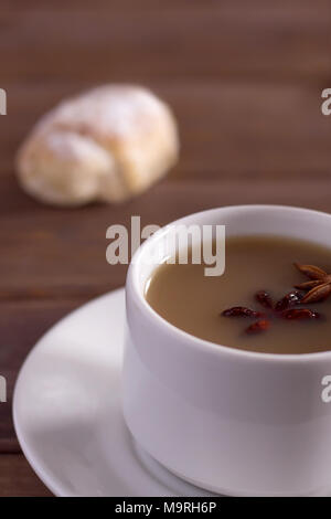 indian tea masala white cap spices on wooden background Stock Photo - Alamy