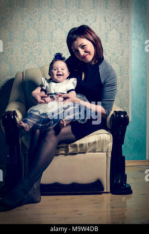 a parent holds the hand of a small child Stock Photo - Alamy