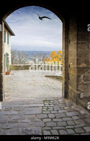 Cobbled street and archway Stock Photo - Alamy