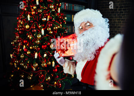 Santa claus portraits and lifestyle. Making selfie with christmas ...