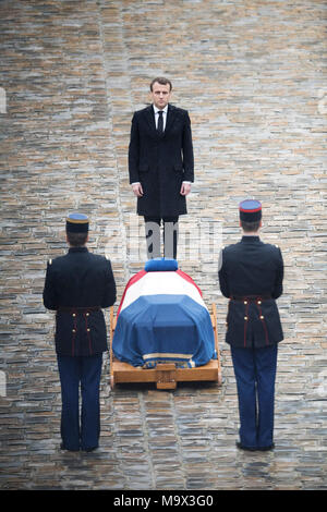 French President Emmanuel Macron and the coffin at a national tribute ...