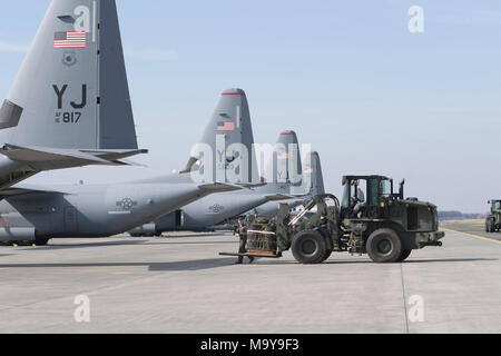 Airmen with the 374th Logistics Readiness Squadron and 36th Airlift ...