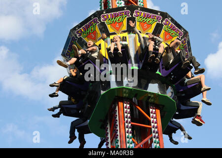 Riders on the Super Shot drop tower amusement ride. Canfield Fair ...
