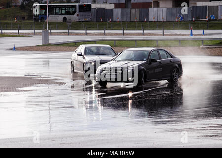 Mercedes C63 AMG on the skid pan at Mercedes-Benz World, Brooklands in ...