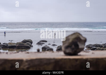 Local fishermen fishing at shore of Batanes, Philippines Stock Photo ...