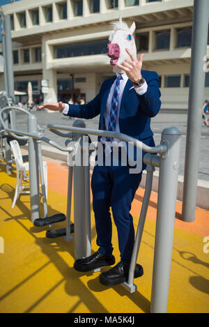 Crazy businessman shows his muscles Stock Photo - Alamy