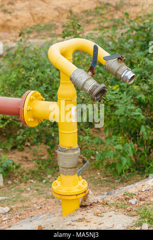 yellow valve water pump and red pipe line Stock Photo - Alamy