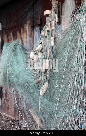 Fishing net drying on the wall of a house in Honfleur in french ...