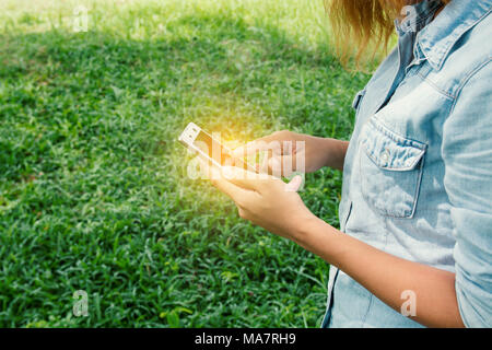 Young hipster woman taping in cell phone Stock Photo - Alamy