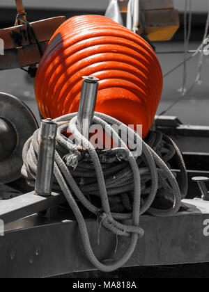 detail of red metal steel buoy and blue sky in sun Stock Photo - Alamy