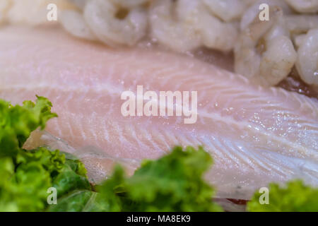 Raw tilapia fish ready for cooking Stock Photo - Alamy