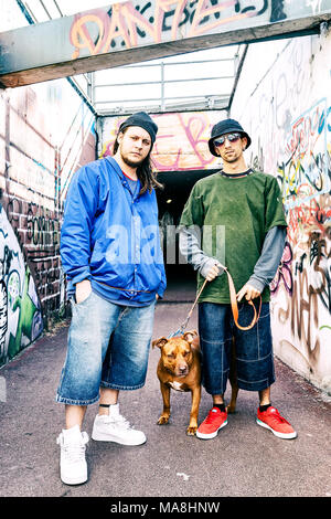 two rap singers in a subway with graffiti in the background Stock Photo ...