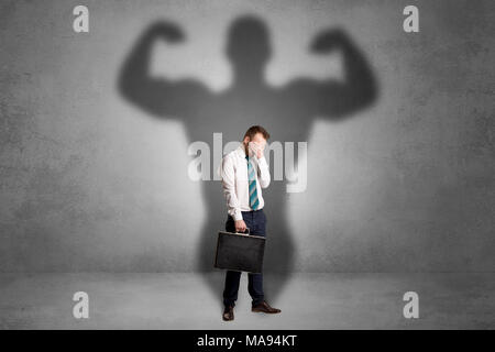 Lovely serious businessman standing with a muscular powerful shadow ...