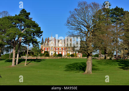 Landscaped gardens with 19th-century château housing Chateau Impney ...