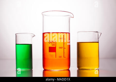 Laboratory beakers filled with green color liquid substances Stock ...