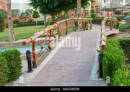 Stone bridge railing with bamboo over a stream Stock Photo - Alamy