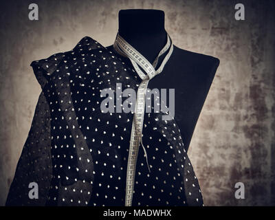 A dummy for fitting and convenience of tailoring, on the neck of which ...