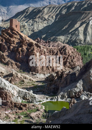 Ancient Tibetan royal palace of Basgo on a dark rock over the village ...