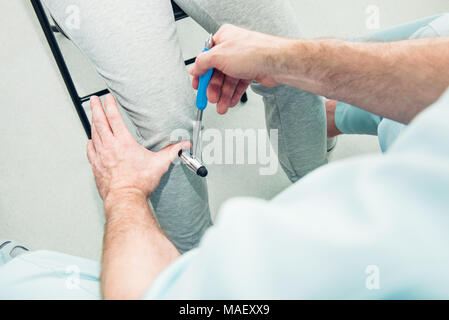 Neurological physical examination of the elbow flexion reflex. Doctor ...