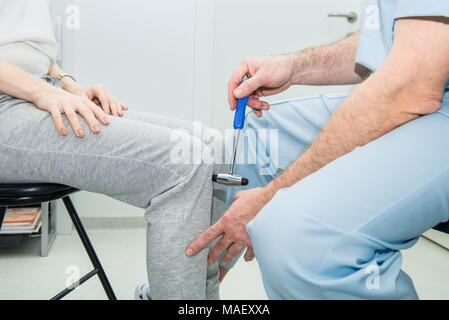 Neurological physical examination of the elbow flexion reflex. Doctor ...