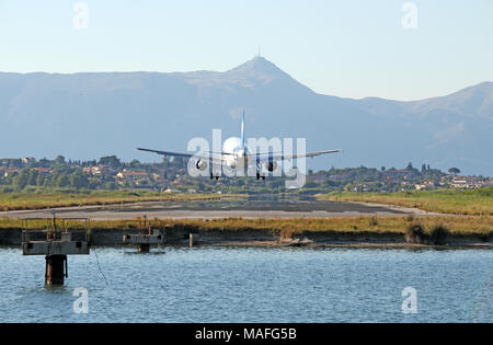 passenger airplane landing on Corfu airport summer season Stock Photo ...