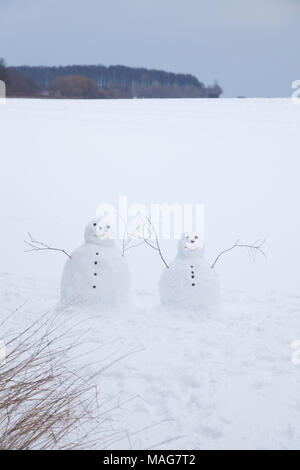 Snowmen Side by Side Stock Photo - Alamy