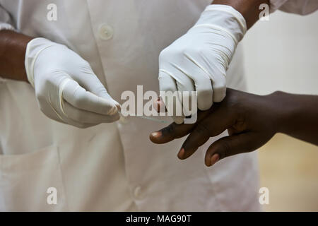 Doctor's hands making a patient's blood test Stock Photo - Alamy