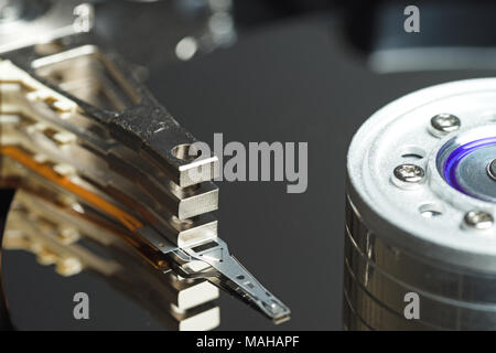 Hard disk drive inside close-up, spindle, actuator arm, read write head ...