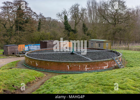 Sewage treatment works, Suffolk, UK. The rotating arms pouring sewage ...