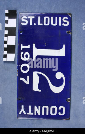 A 1907 enameled St. Louis County license plate features early 20th ...