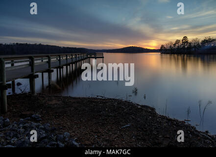 Sunset - Lake Sidney Lanier. A winter sunset reflected on the water's ...