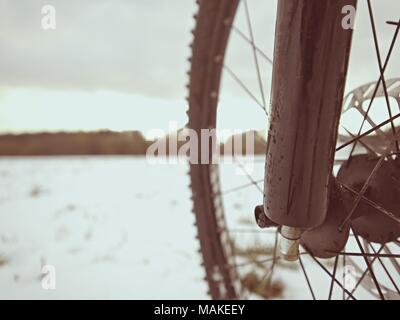 Winter snow riding on mountine bike. Extreme weather, slippery road in ...