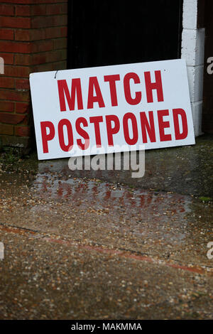 A Match Postponed sign outside Pagham Football Club in West Sussex, UK ...