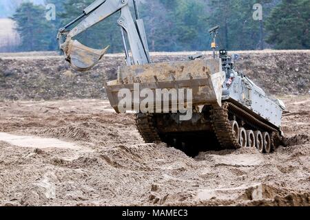 A "Terrier" armored digger from the United Kingdom's 22nd Engineer ...