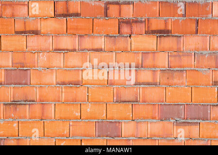 Works of construction of thermal clay block walls in construction site ...