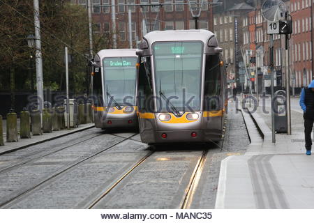 Two Dublin Luas trams on Abbey Street crossing O'Connell Street, Dublin ...
