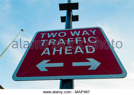 Two way traffic ahead road sign with opposing directional arrows Stock ...