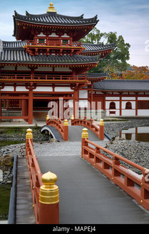 Beautiful red bridge at Buddhist temple Ryuan-ji at Minoh National Park ...