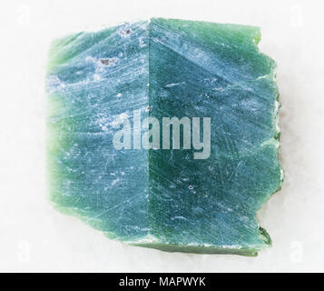 rough nephrite stone slab on dark background Stock Photo - Alamy