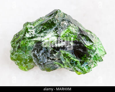 specimen of natural raw chromian diopside mineral cutout on white ...