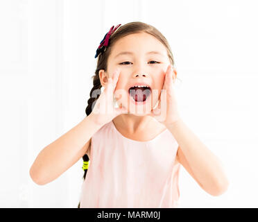 Portrait of a little girl shouting loud Stock Photo - Alamy
