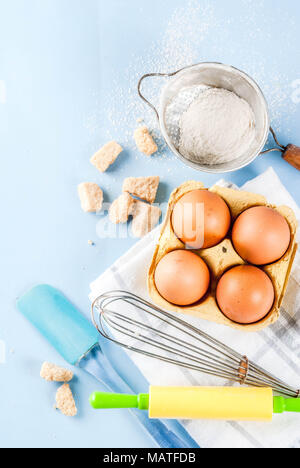 Cooking ingredients and utensils on blue background. Flat lay with copy ...