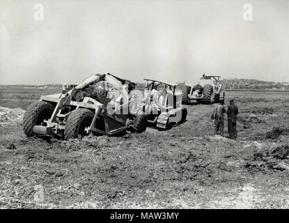 Soil conservation machines levelling on surface irrigation farm ...