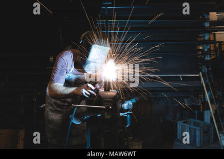 Blacksmith using a welding torch Stock Photo - Alamy