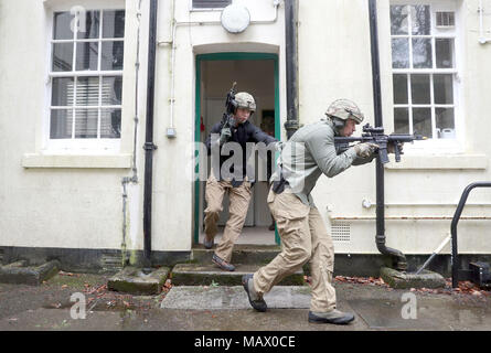 Members of the Close Protection Unit Royal Military Police clear a ...