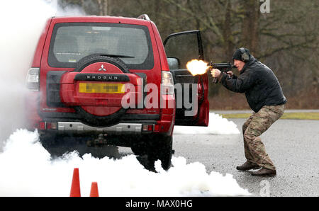 Members of the Close Protection Unit Royal Military Police clear a ...